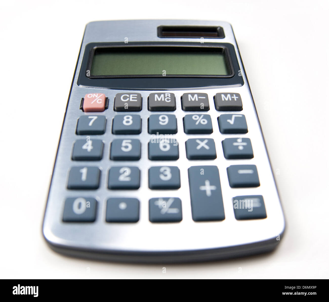 Silver calculator with empty screen on white background. Shallow depth ...