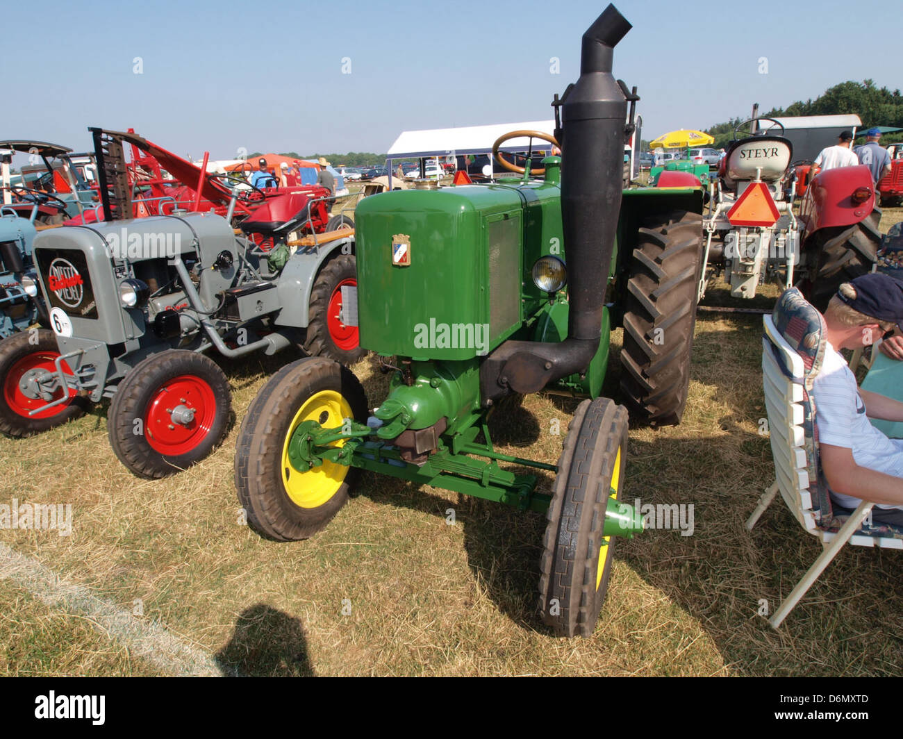 The Green SFV tractor is a robust farming vehicle designed for ...
