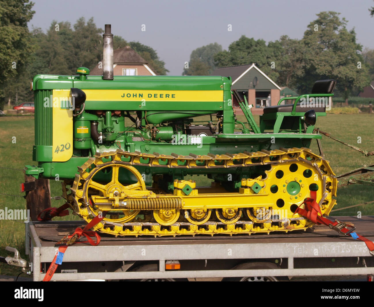 The John Deere 420-11 is a compact farm tractor produced in the mid ...