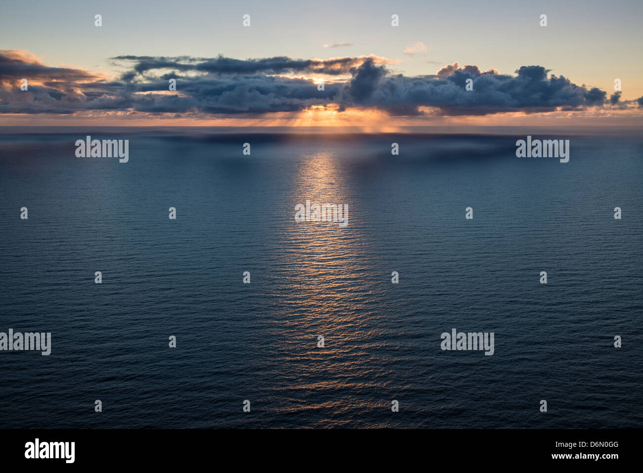 Late summer sun low on horizon over Norwegian sea, Lofoten Islands ...