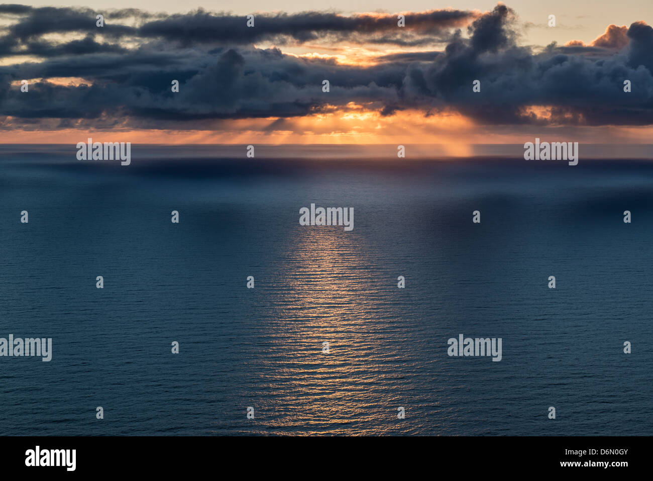 Late summer sun low on horizon over Norwegian sea, Lofoten Islands ...