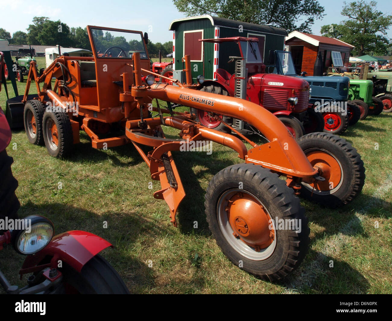 The Orange Allis-Chalmers Greader is a vintage agricultural grader ...
