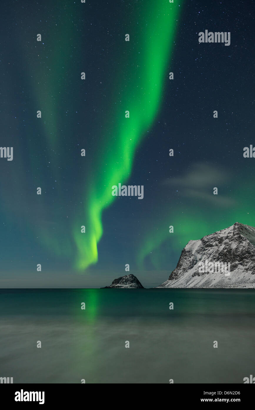 Aurora Borealis - Northern Lights shine in sky over snow covered ...