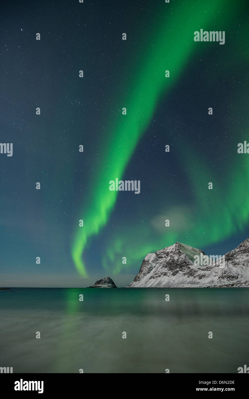 Aurora Borealis - Northern Lights shine in sky over snow covered ...