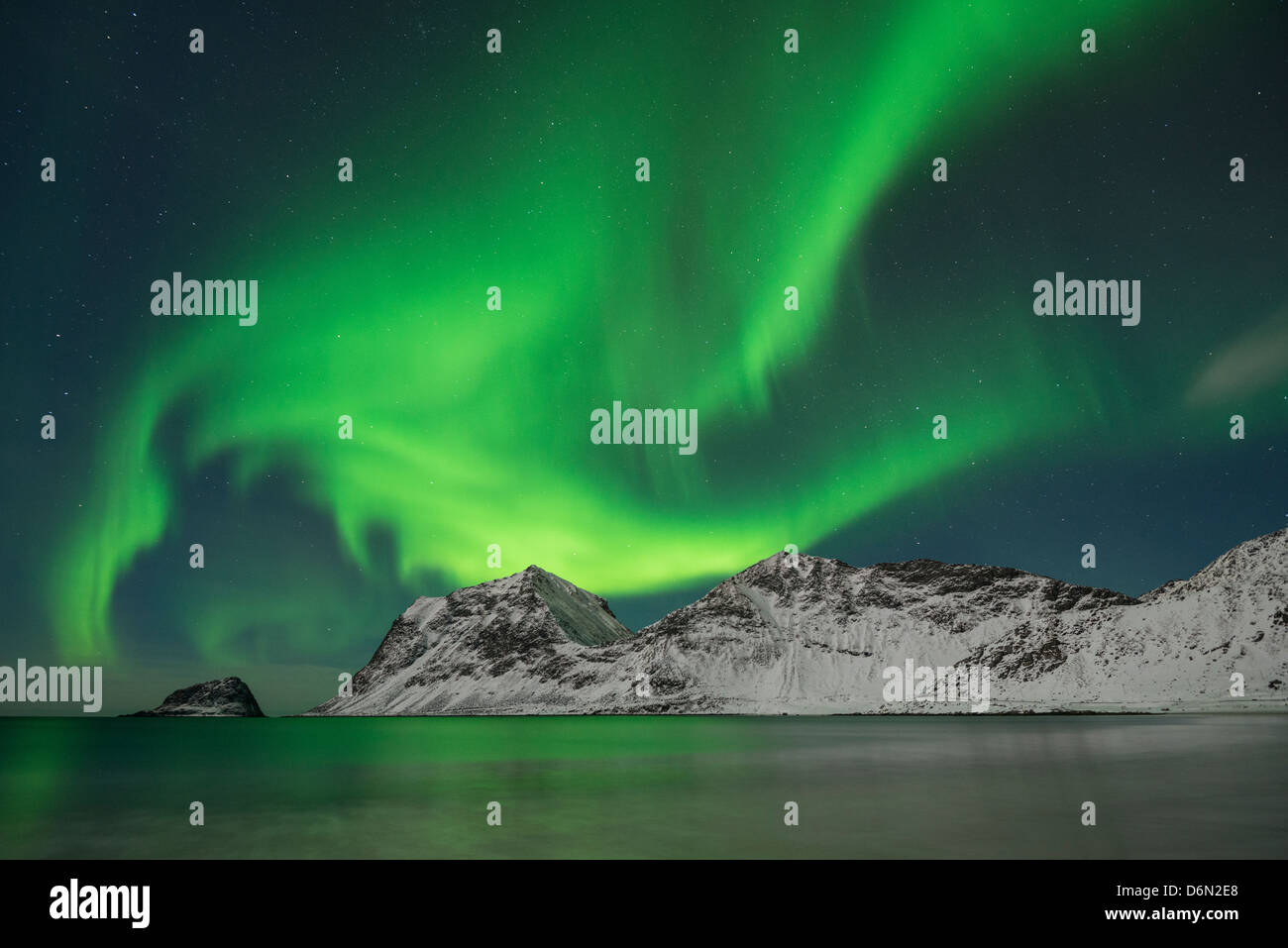 Aurora Borealis - Northern Lights shine in sky over snow covered ...
