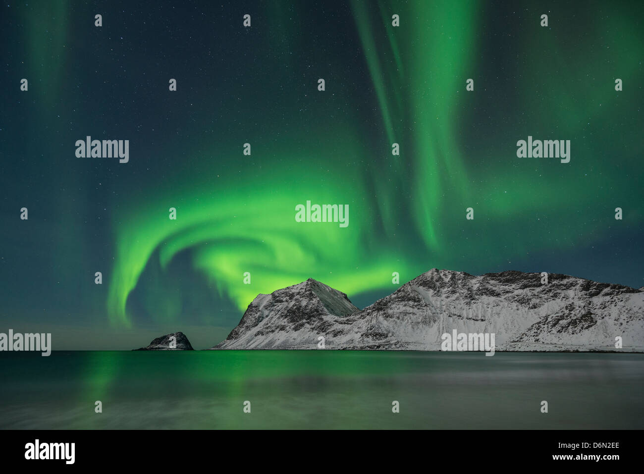 Aurora Borealis - Northern Lights shine in sky over snow covered ...