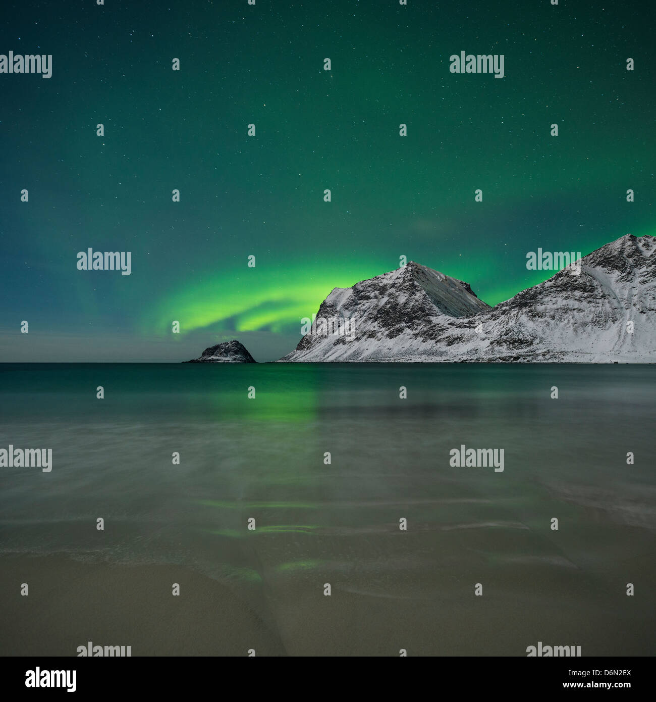 Aurora Borealis - Northern Lights shine in sky over snow covered ...