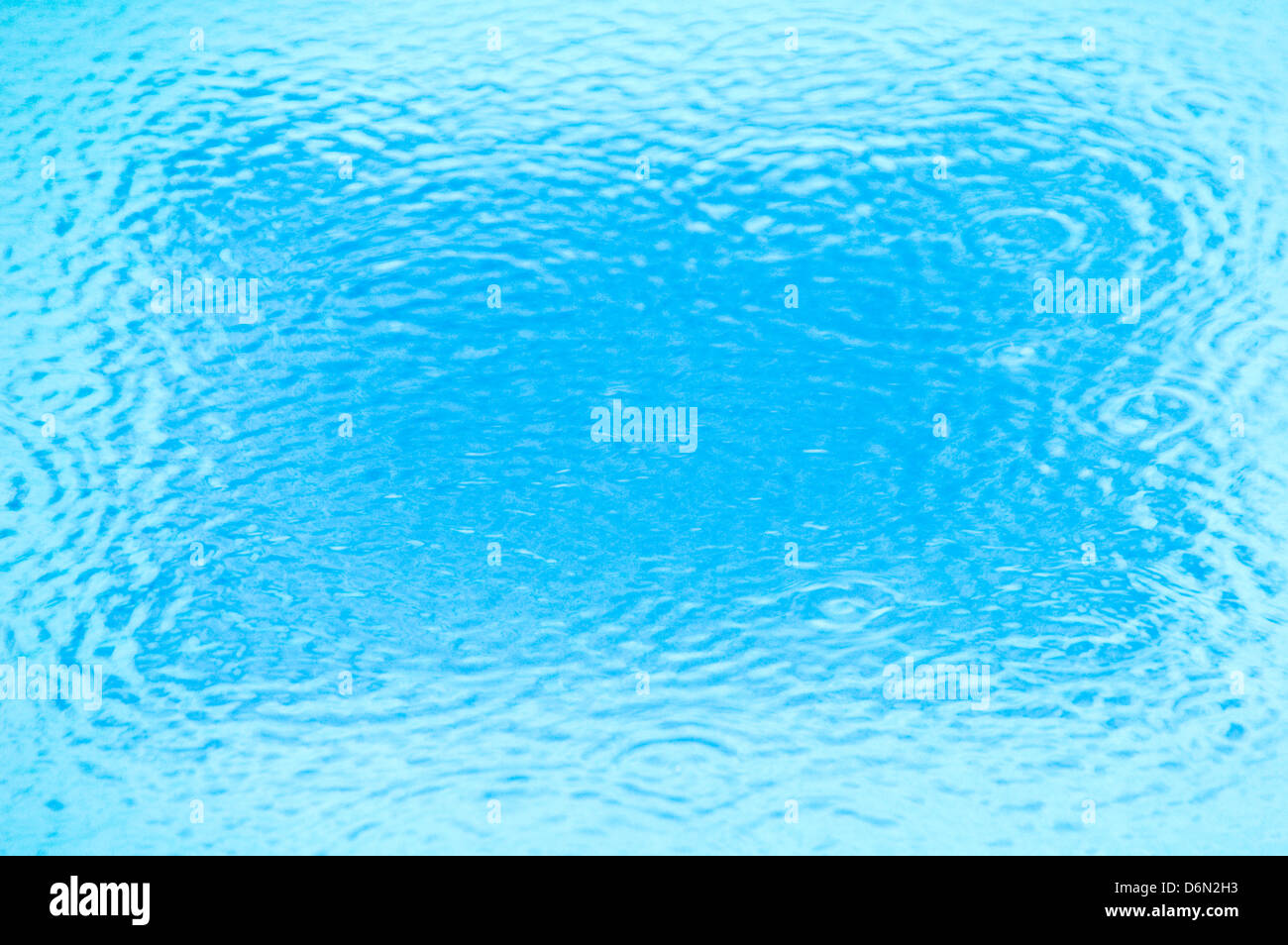Rain Ripples on Swimming Pool Surface Stock Photo - Alamy