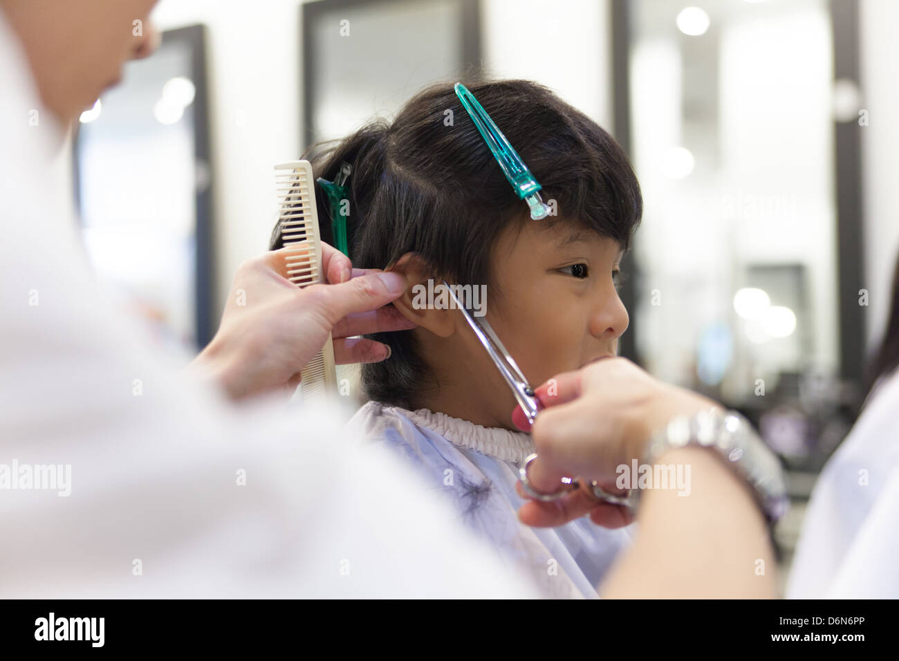 A young boy getting haircut in hair salon Stock Photo - Alamy