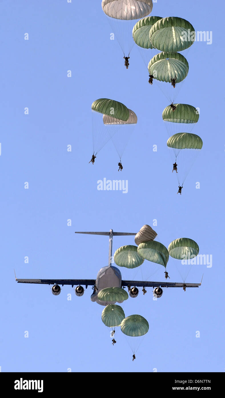 US Army paratrooper soldiers parachute during an airdrop exercise April ...