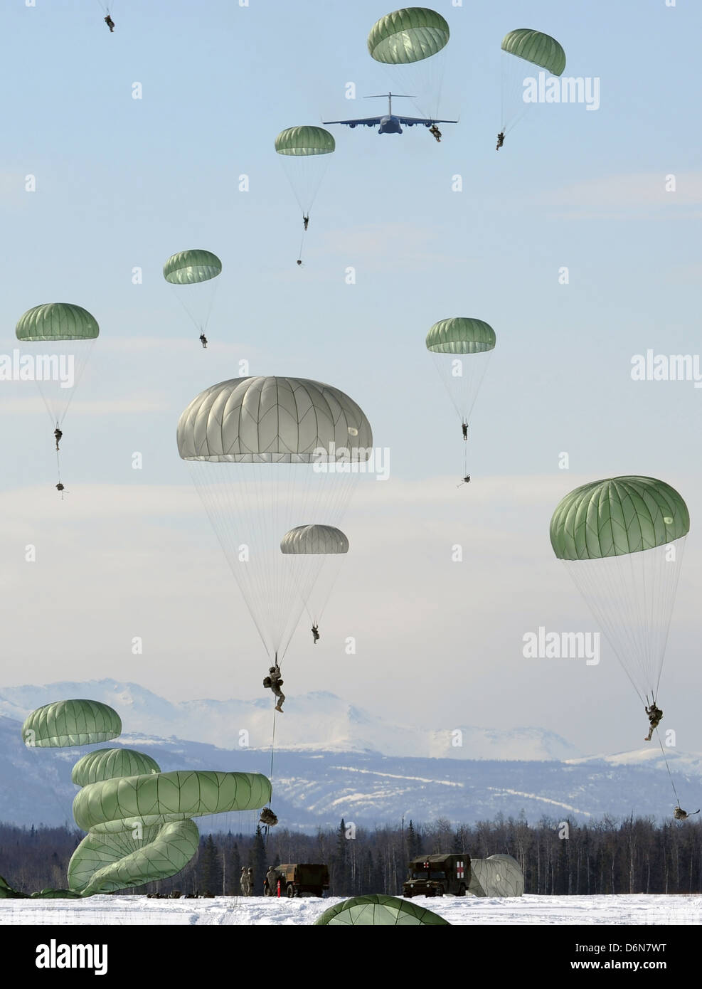 US Army paratrooper soldiers parachute during an airdrop exercise April ...