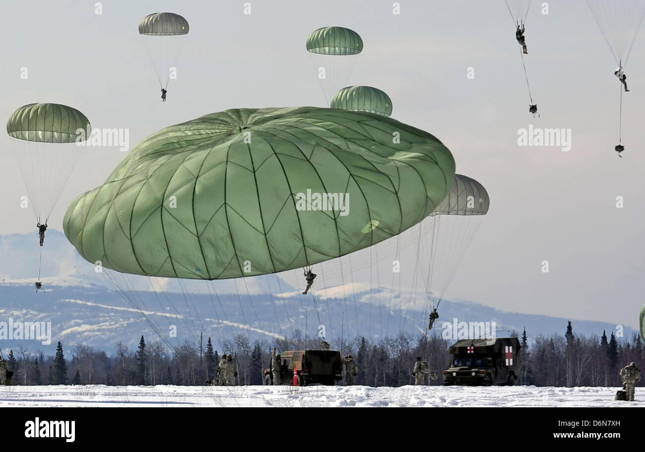 US Army paratrooper soldiers parachute during an airdrop exercise April ...