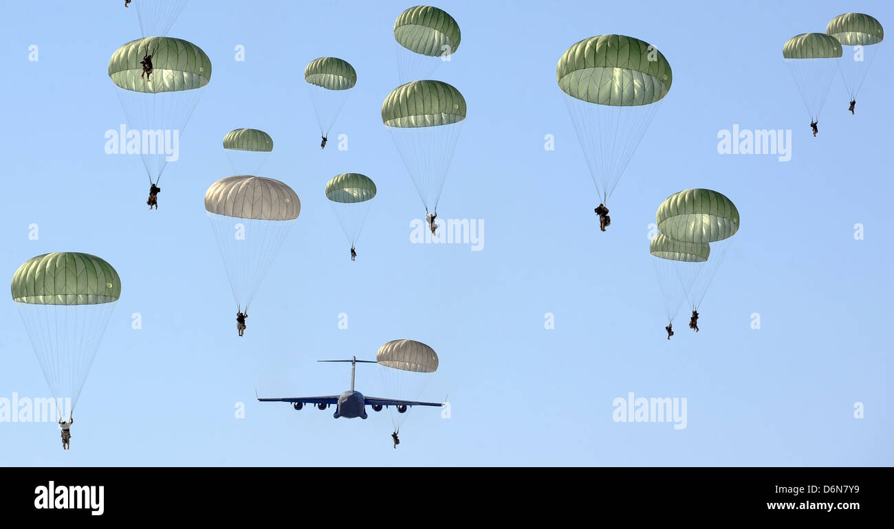 US Army paratrooper soldiers parachute during an airdrop exercise April ...