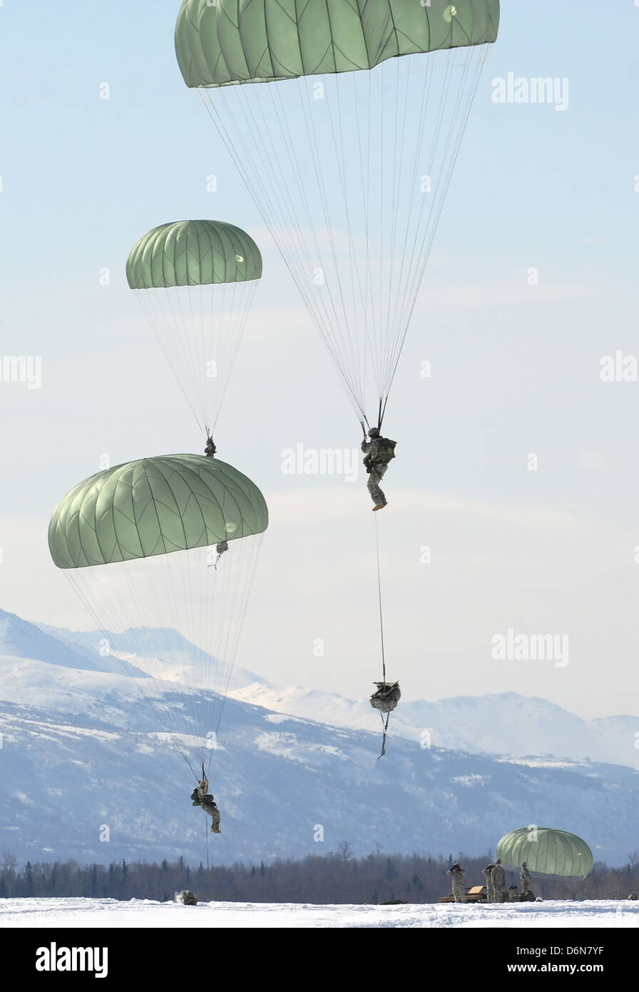 US Army paratrooper soldiers parachute during an airdrop exercise April ...