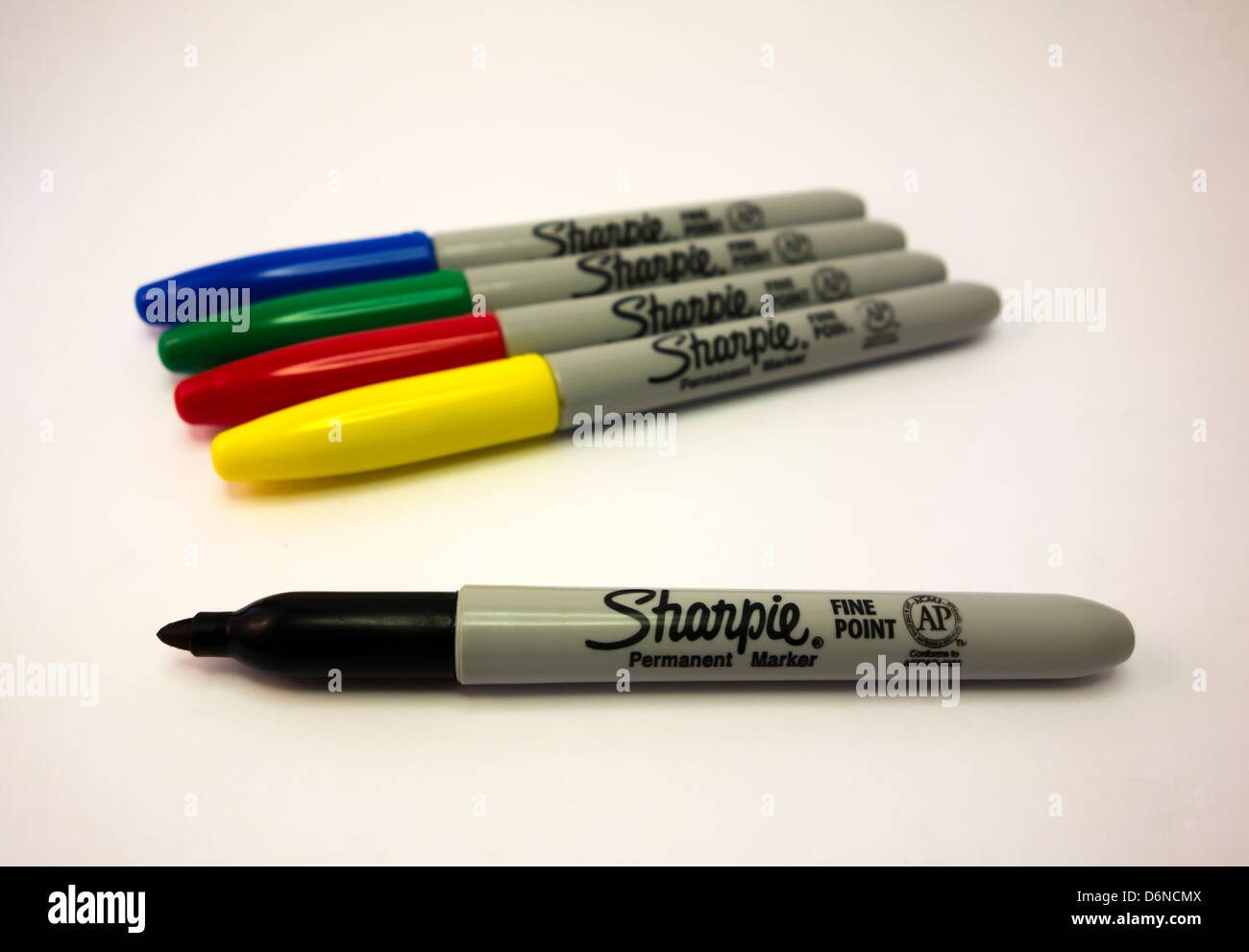 Sharpie permanent markers on a white background. Black marker in focus ...