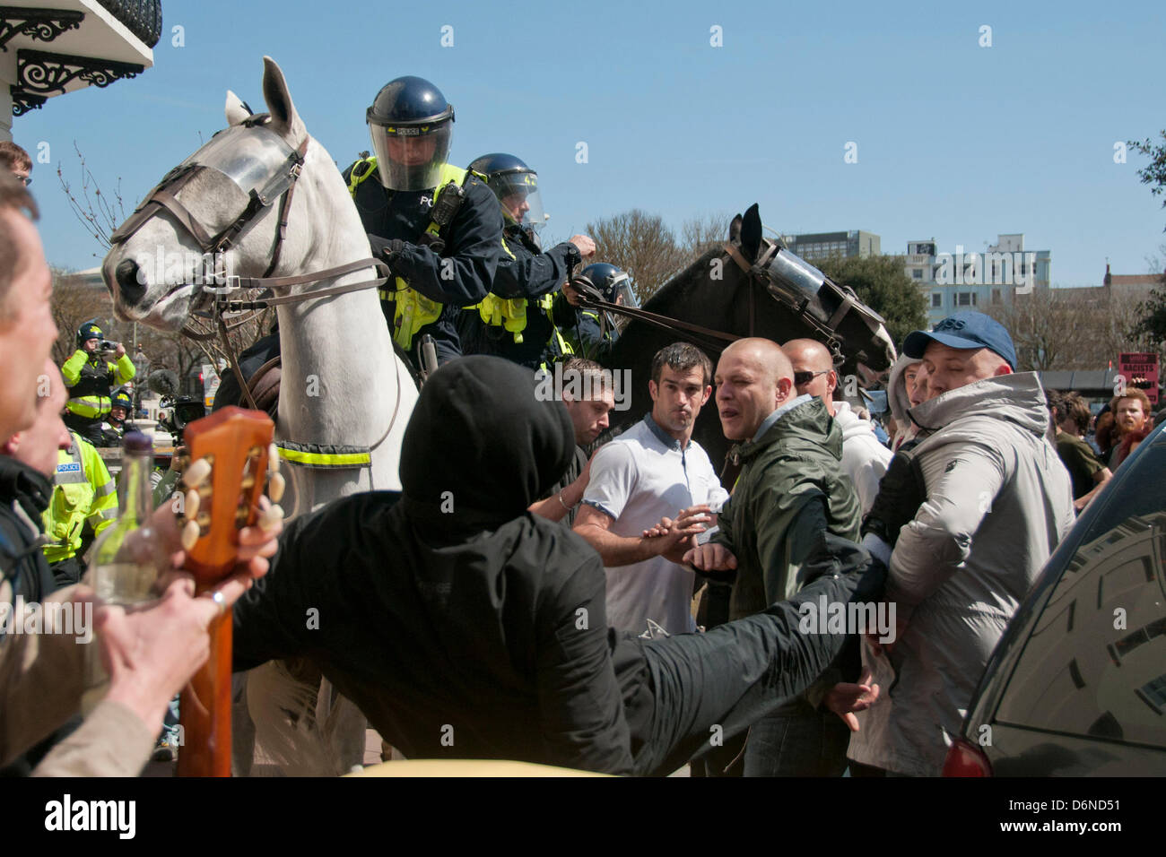 Brighton, UK. 21st April, 2013. Disorder breaks out as riot police ...