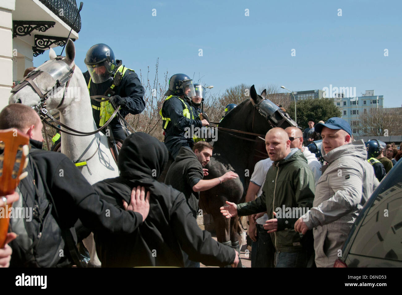 Brighton, UK. 21st April, 2013. Disorder breaks out as riot police ...