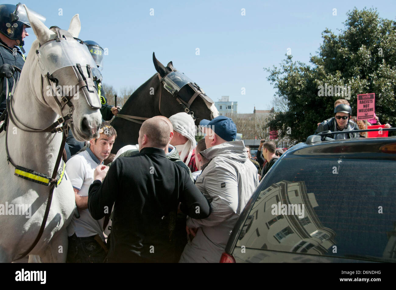 Brighton, UK. 21st April, 2013. Disorder breaks out as riot police ...