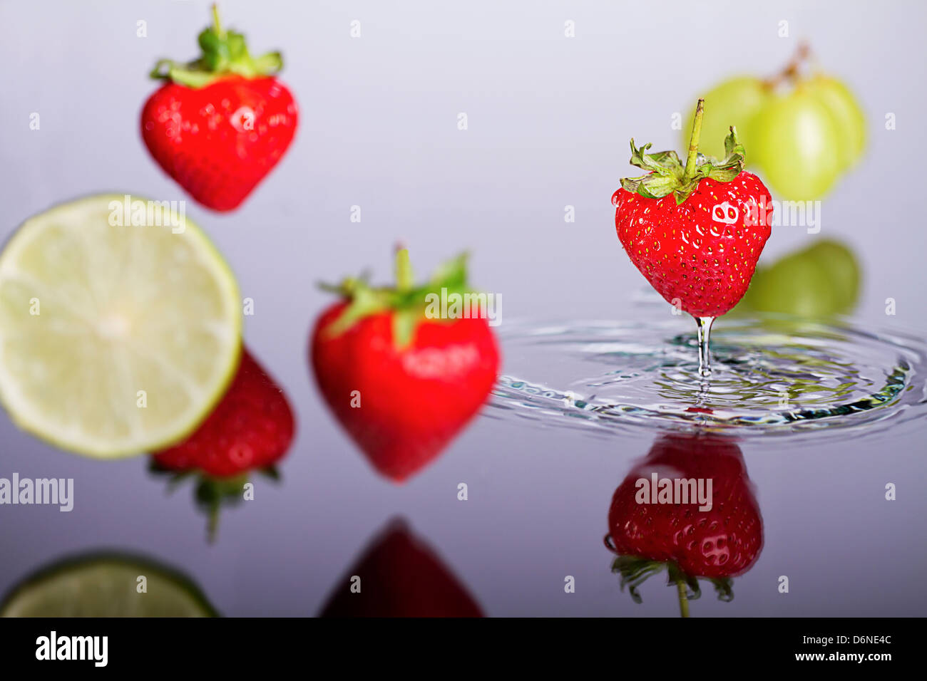Floating fruits above the water surface Stock Photo - Alamy