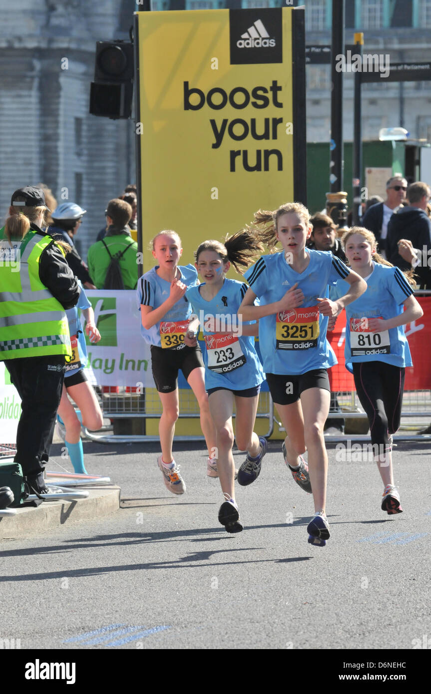 Westminster, London, UK. 21st April 2013. A group of girls running the mini marathon. The Virgin ...