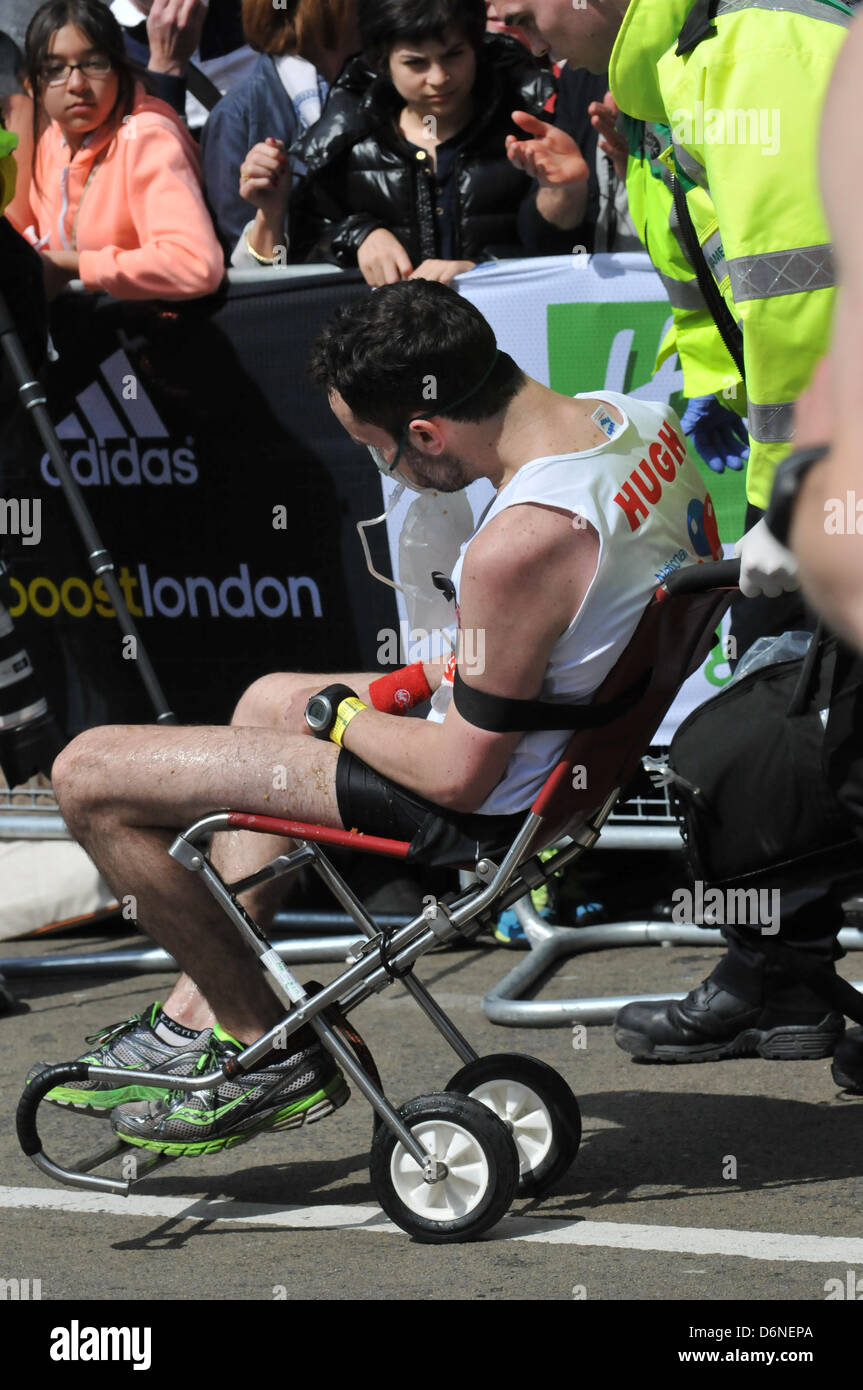 Westminster, London, UK. 21st April 2013. A runner collapses after 25 ...