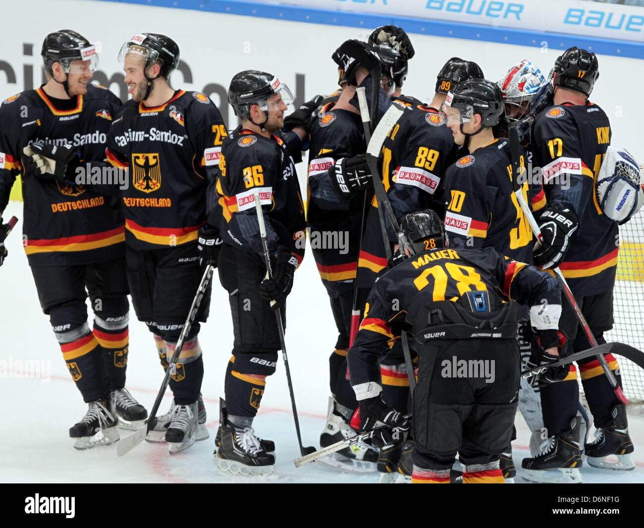 German players gesture after they win the international ice hockey ...