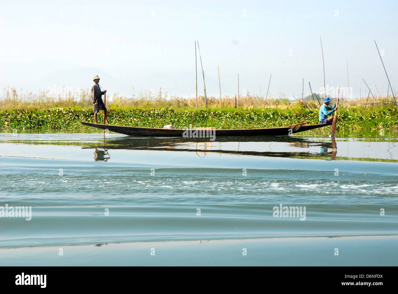 Two boatmen standing on the boat hi-res stock photography and images ...