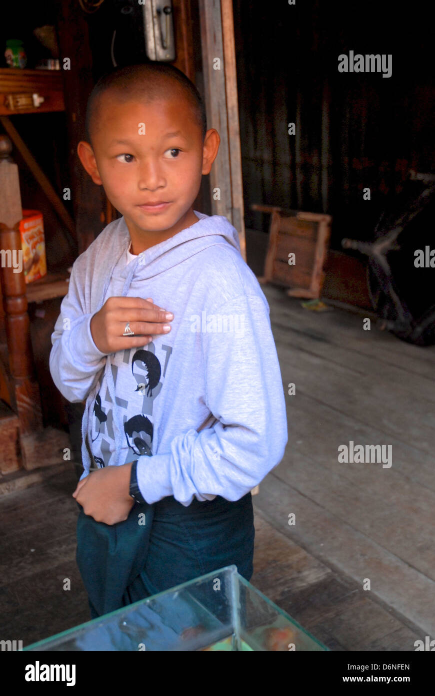Young Burmese boy in shop Stock Photo - Alamy