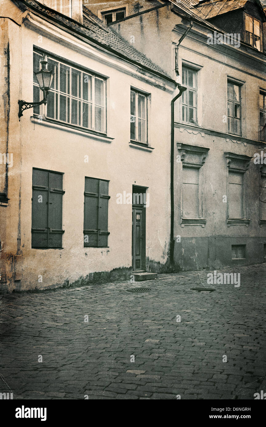 Vintage style photo of old European town street Stock Photo - Alamy