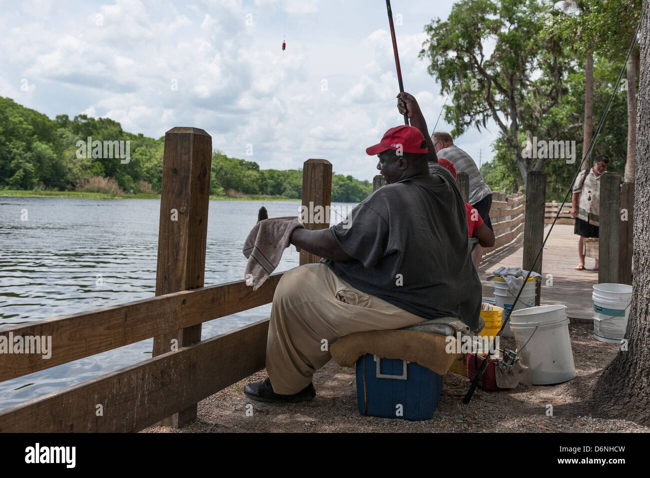 A black man fishing for Mullet on the St.Johns River in Central Florida ...
