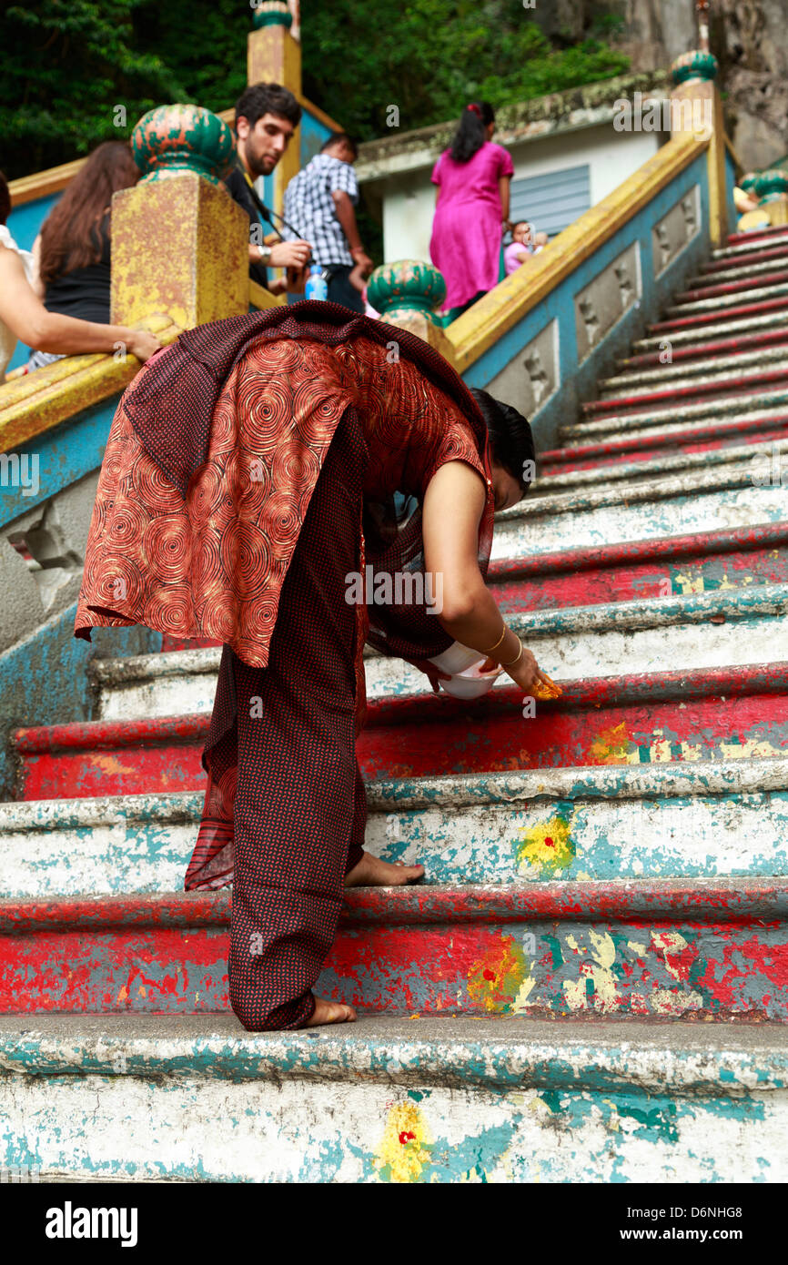 A Hindu devotee walking up the steps of Batu Caves, Selangor, Malaysia ...