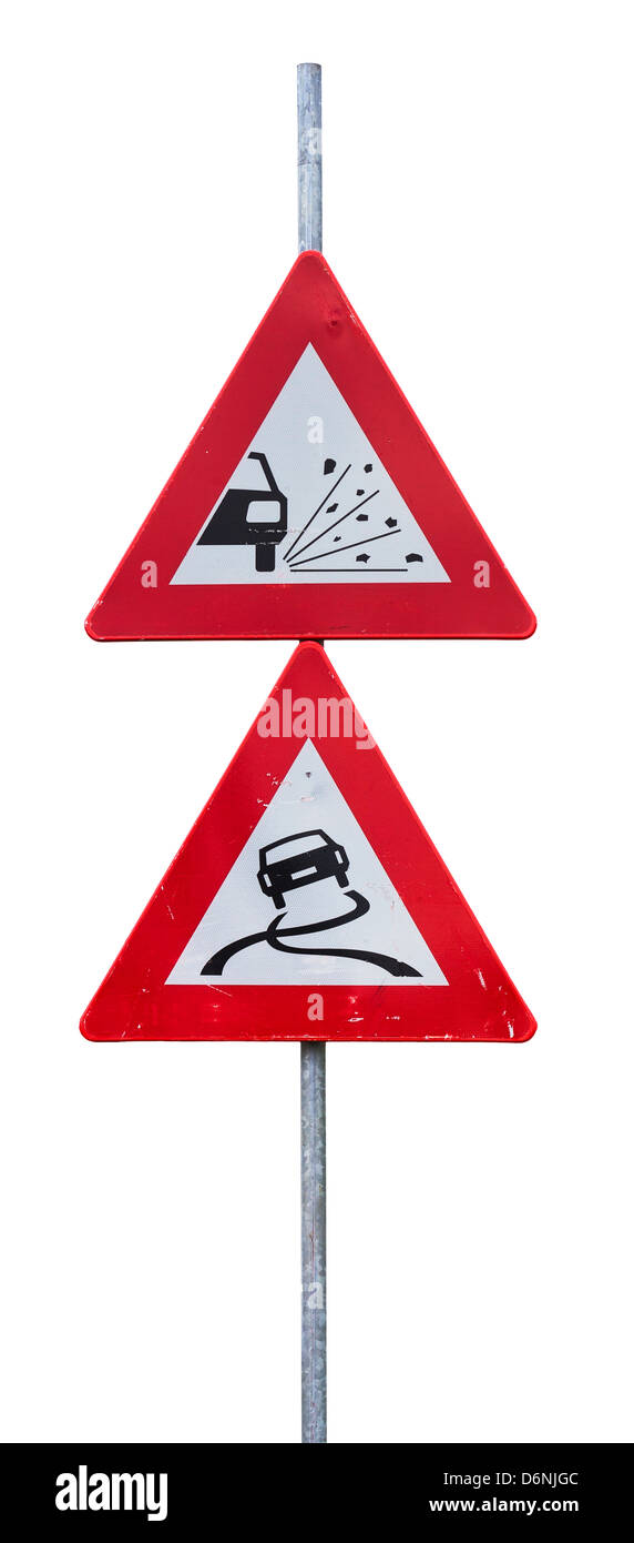 Traffic signs for loose chippings and slippery road against white ...
