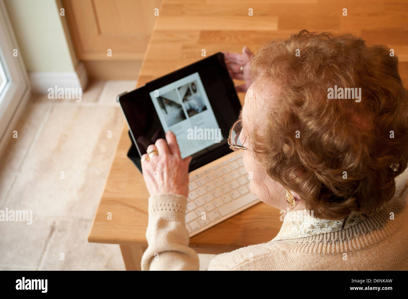 Senior woman uses computer hi-res stock photography and images - Alamy