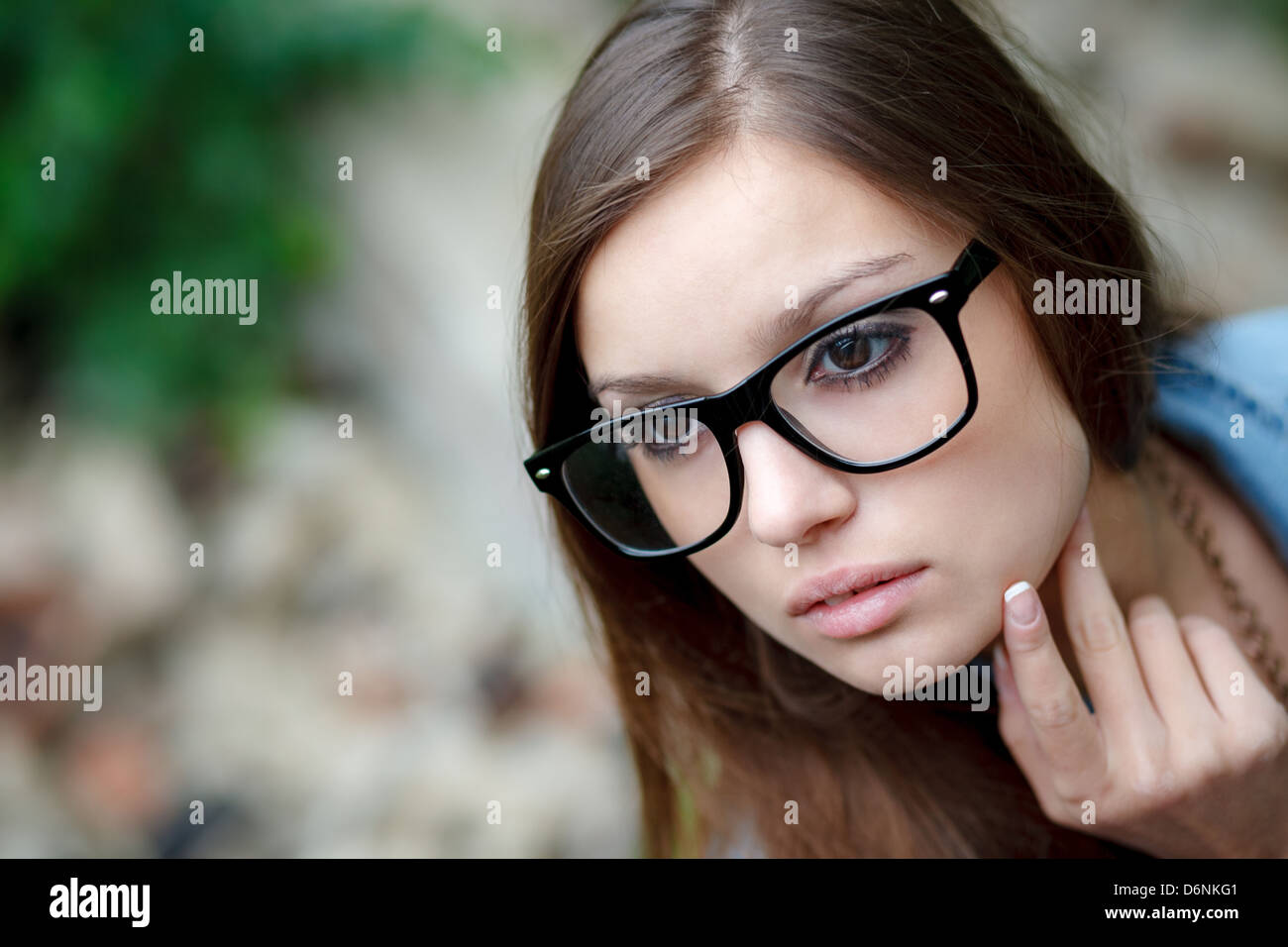young female wear glasses looking sideways closeup Stock Photo - Alamy