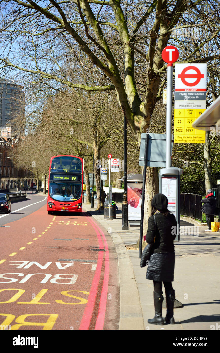 London double-decker bus approaching bus stop, Knightsbridge ...