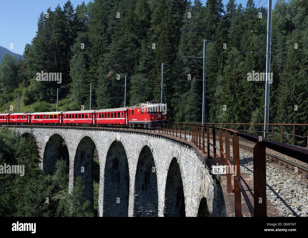 Filisur, Switzerland, the Rhaetian Railway train crossing over the ...