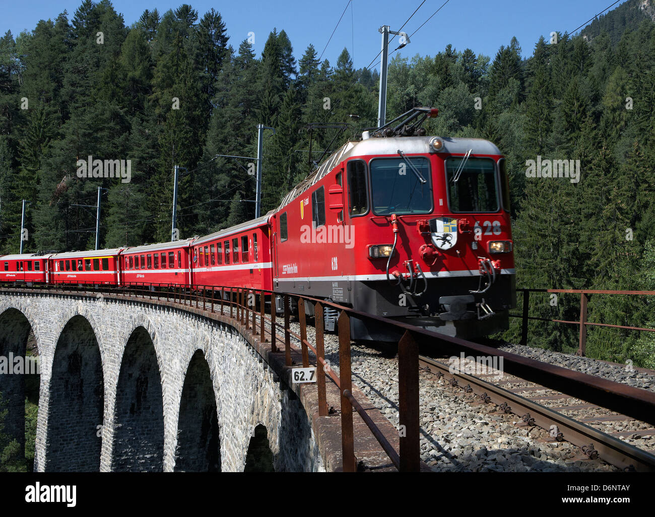 Filisur, Switzerland, the Rhaetian Railway train crossing over the ...