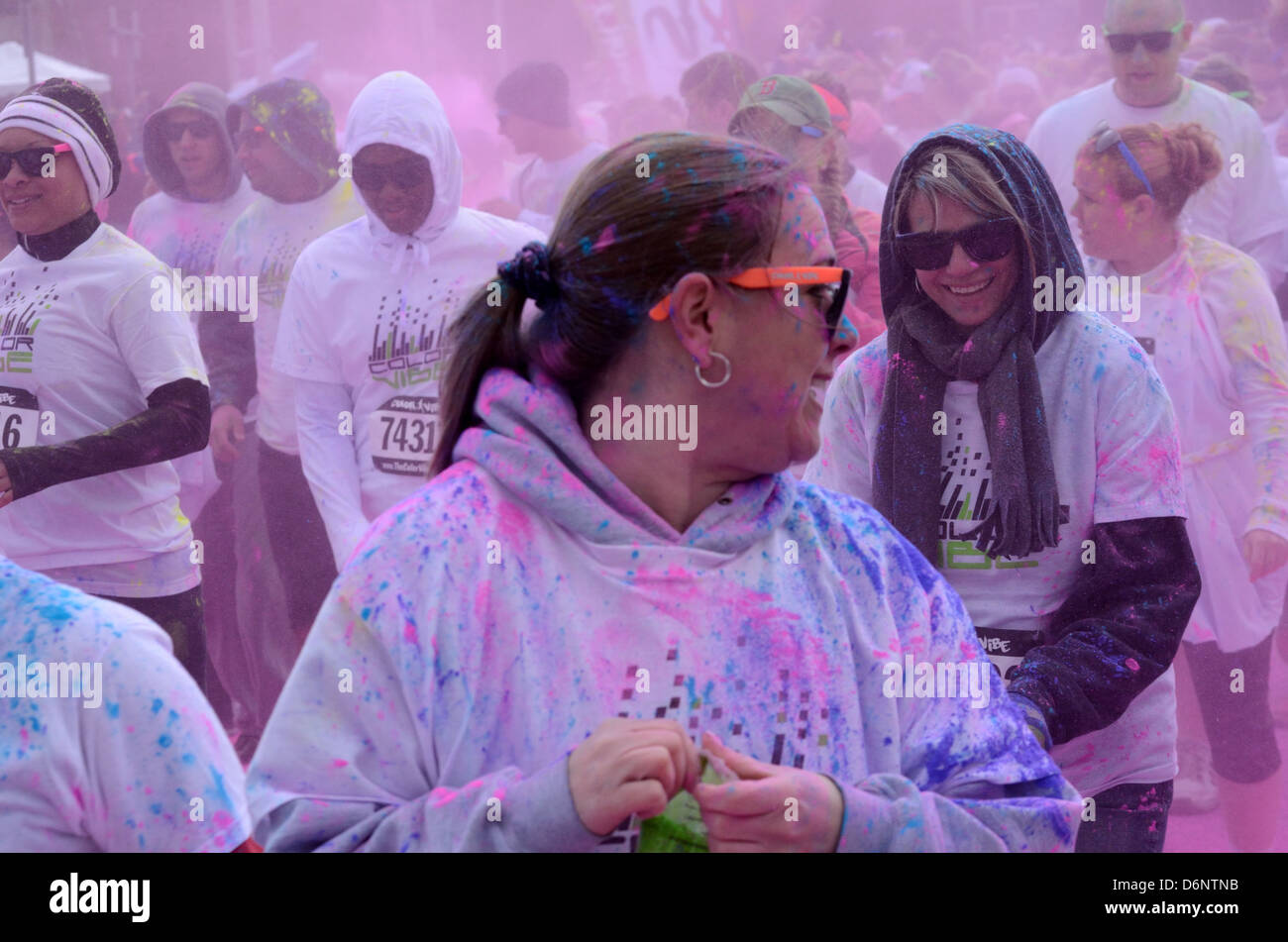 Runners in 5k Race having fun running gauntlet of color Stock Photo - Alamy