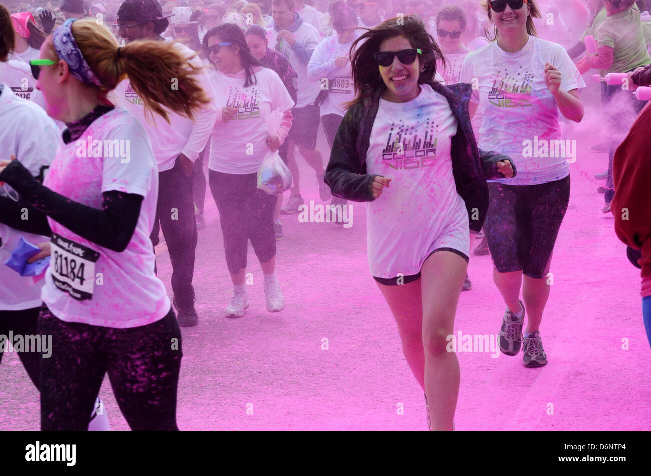 Runners in 5k Race having fun running gauntlet of color Stock Photo - Alamy