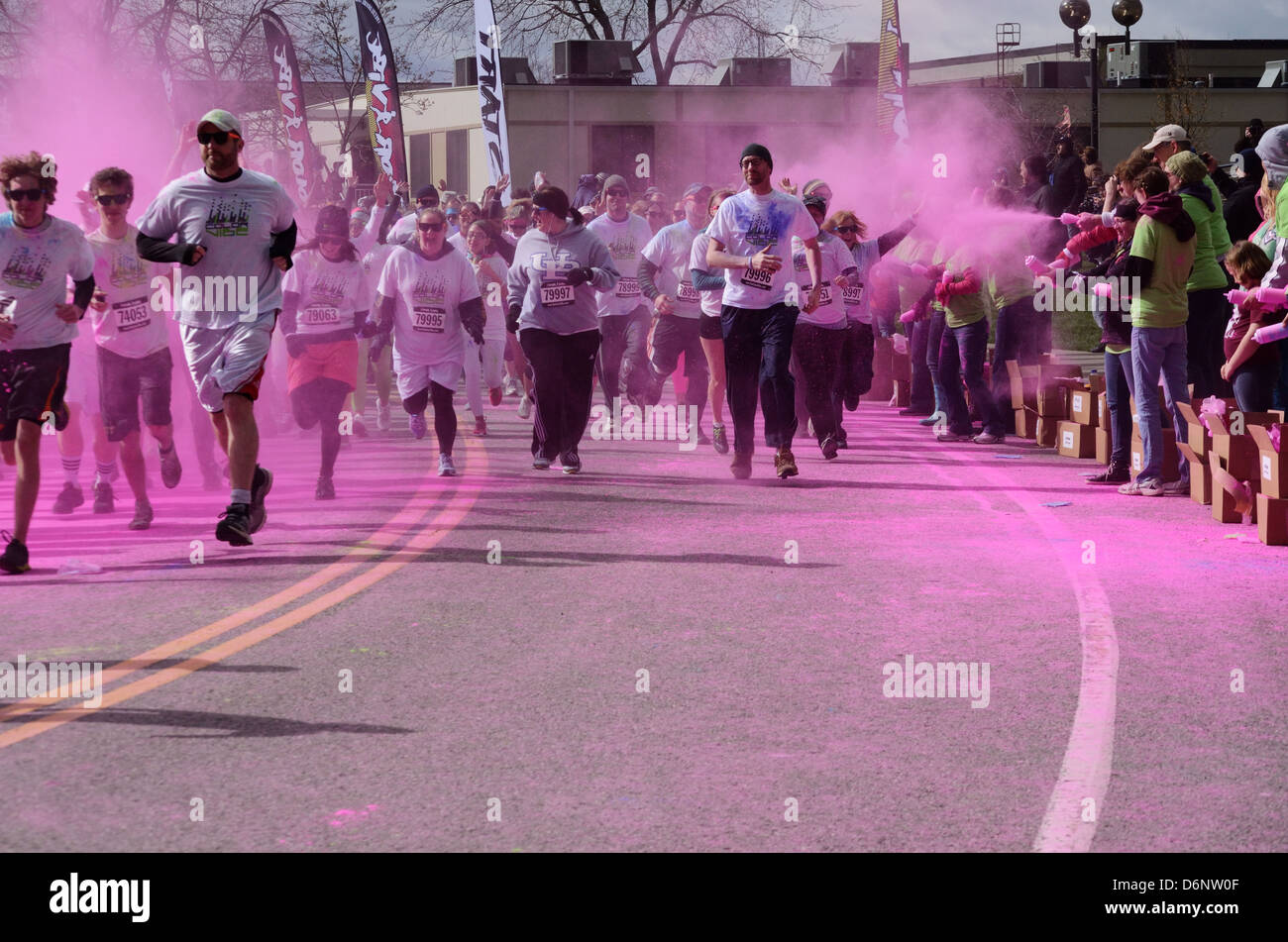 Runners run gauntlet of color at 5k race Stock Photo - Alamy