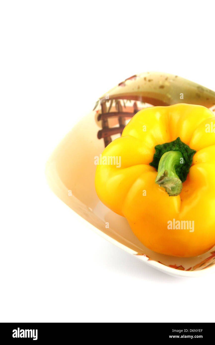 Zoom Yellow Bell peppers in Dish Stock Photo - Alamy