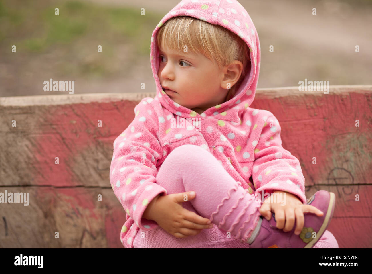 Little Girl on Park Bench Stock Photo - Alamy