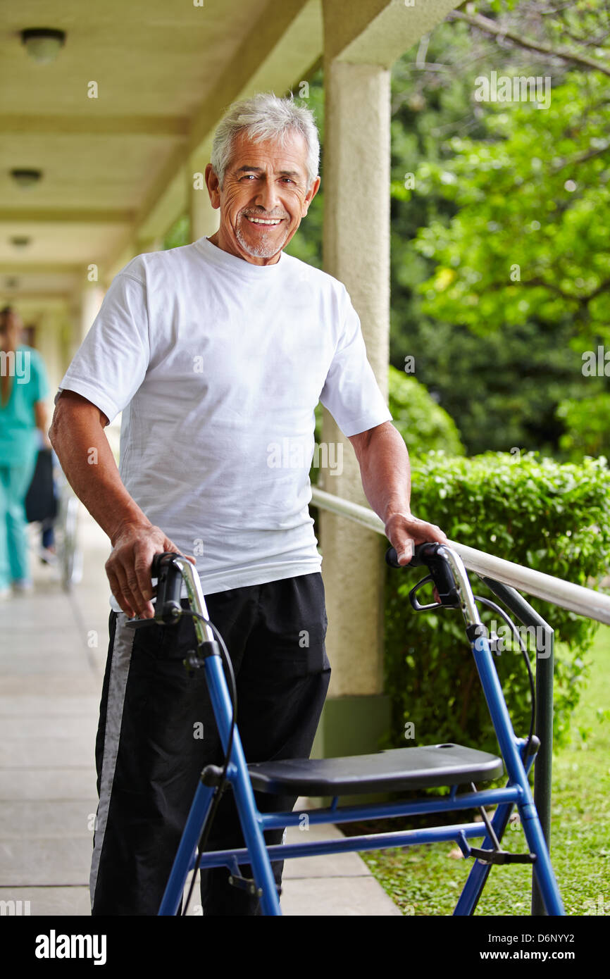 Sick old man walking walker hi-res stock photography and images - Alamy