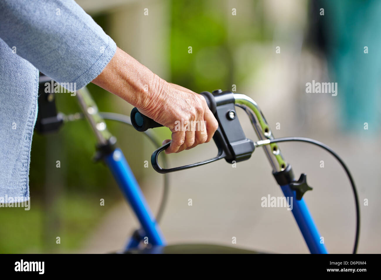 Hands of a senior woman on the handles of a walker Stock Photo - Alamy