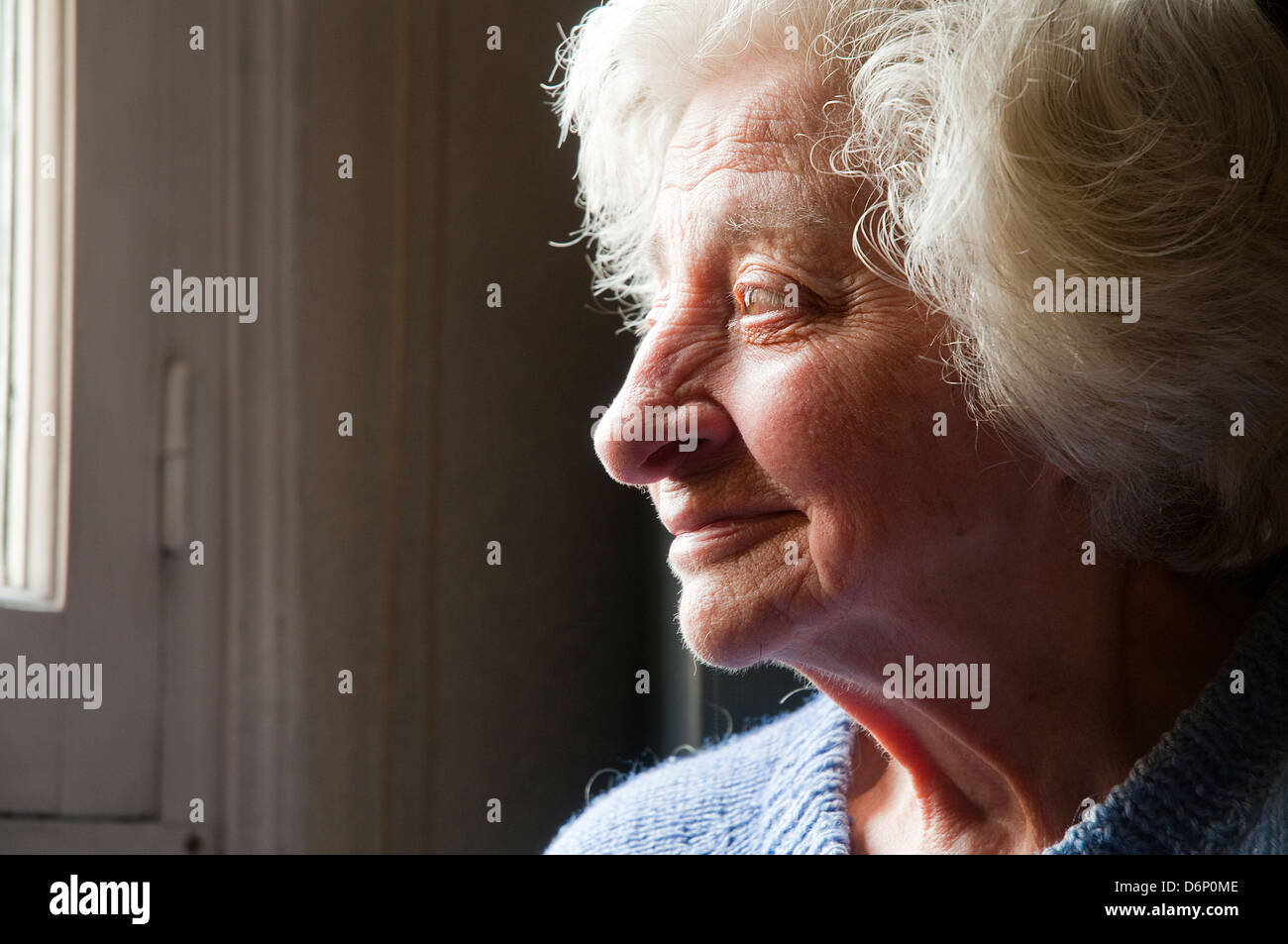 Profile portrait of old woman smiling. Close view Stock Photo - Alamy