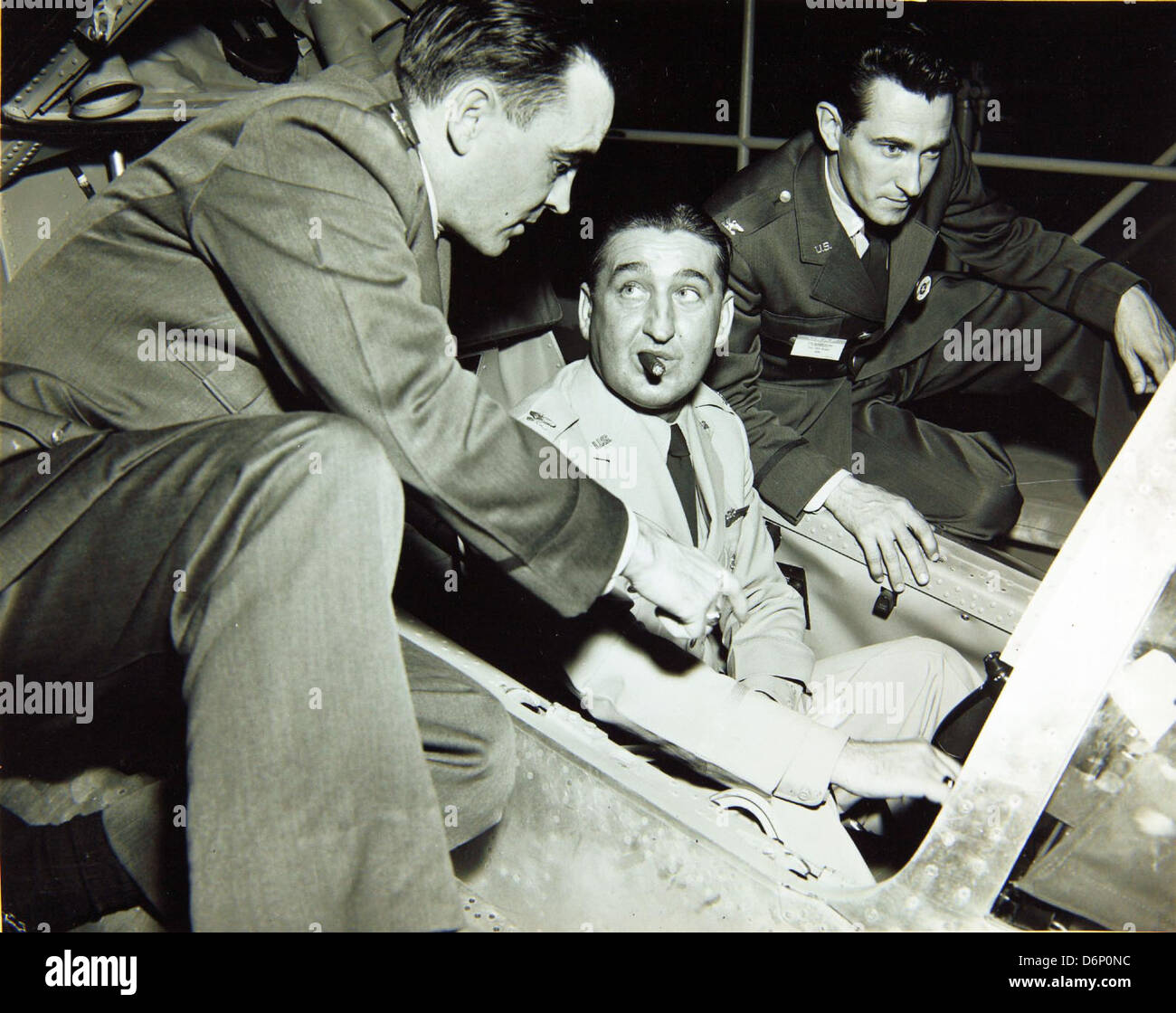 A photograph of Convair/General Dynamics personnel working on the F-102 ...