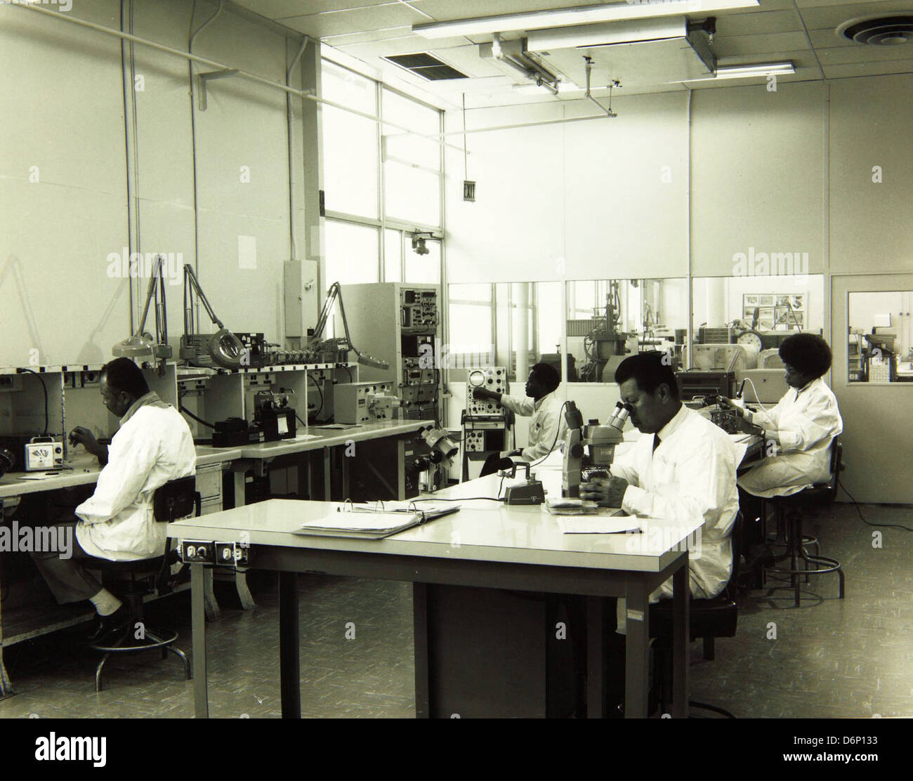 This photograph shows personnel working in the engineering test lab at ...