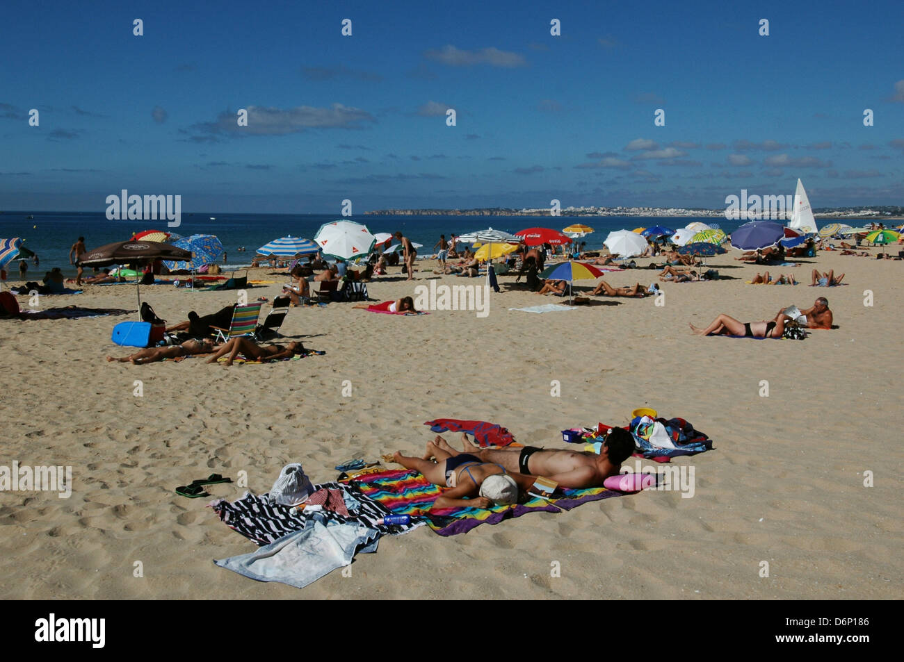 People sunbathing in "Praia de Alvor" Alvor Beach in Alvor a seaside ...
