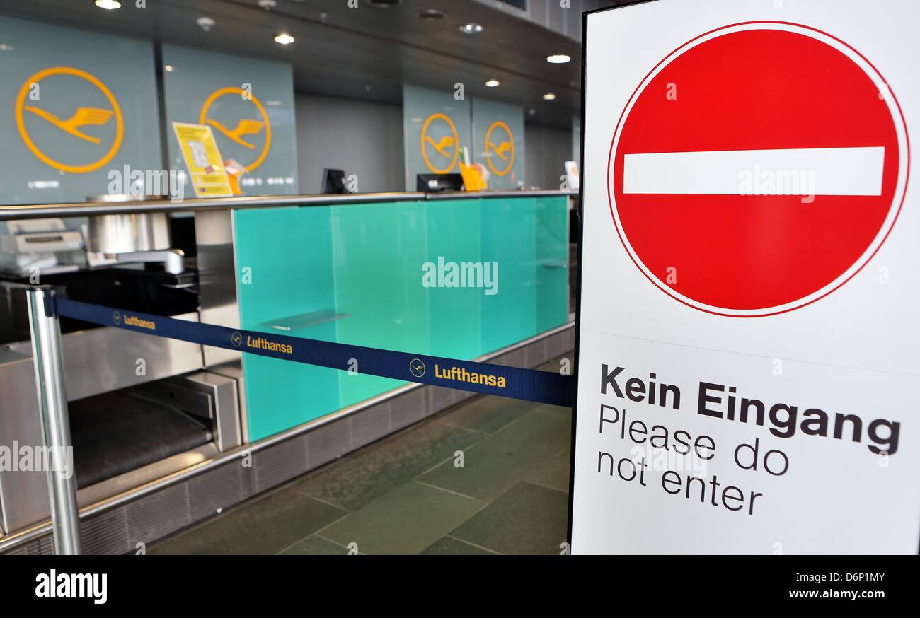 A 'No Entry' traffic sign is situated in front of closed check-in desks ...