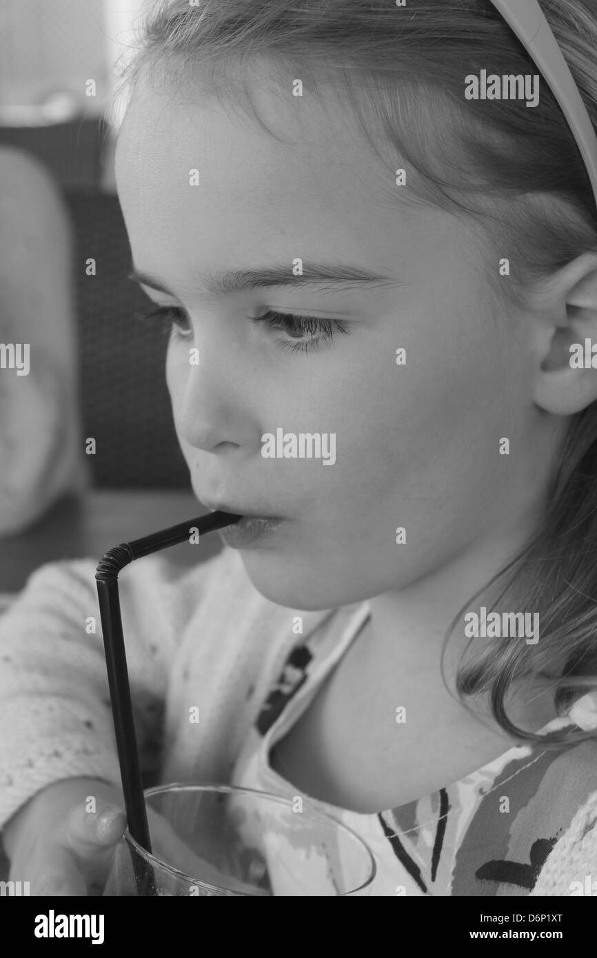 Child drinking through straw hi-res stock photography and images - Alamy